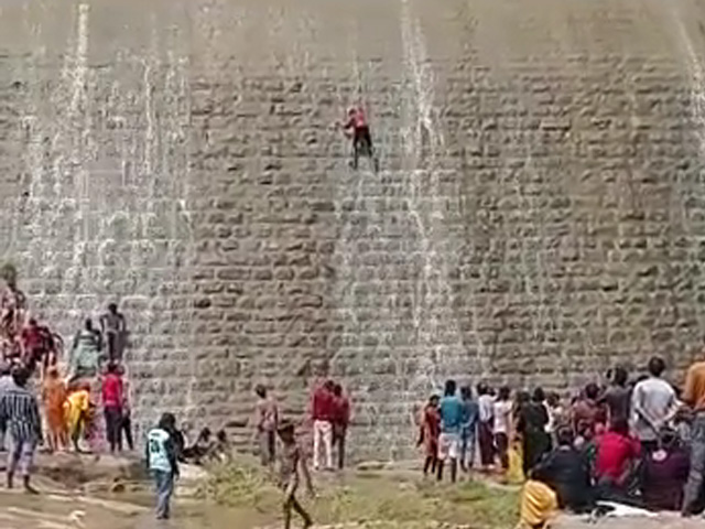 Watch: Man Falls Off Dam Wall During Dangerous Stunt, Now Faces A Case