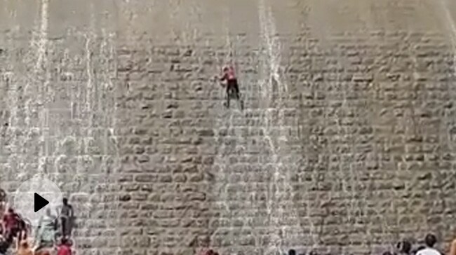 Watch: Man Falls Off Dam Wall During Dangerous Stunt, Now Faces A Case