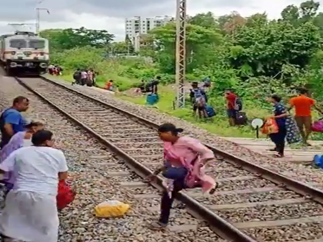 Watch: Woman's Narrow Escape From Oncoming Train
