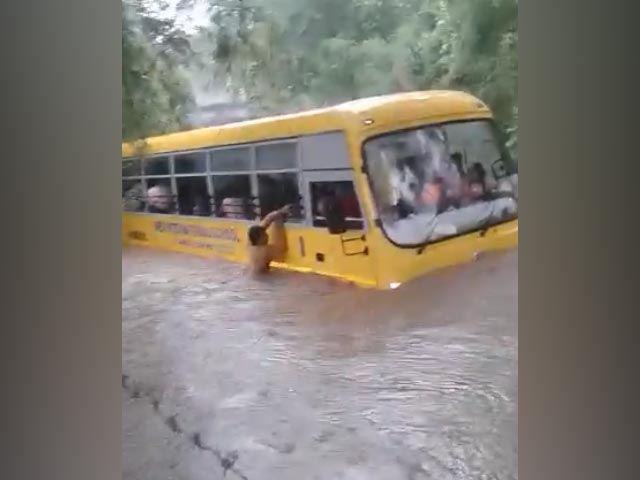 School Bus With Over 2 Dozen Children Stuck In Drain Amid Heavy Rain ...