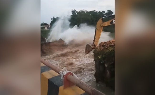 Watch: Bridge Demolished, Bulldozer Crashes Into Water Too. Driver Escapes