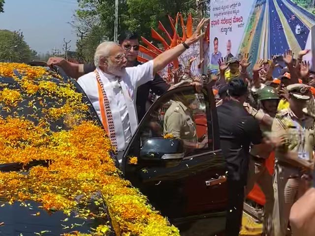 PM Modi Showered With Flowers At Roadshow In Poll-Bound Karnataka
