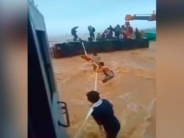 Video: Bus Tips Over On Flooded Road, Rope, Crane Used To Rescue 27