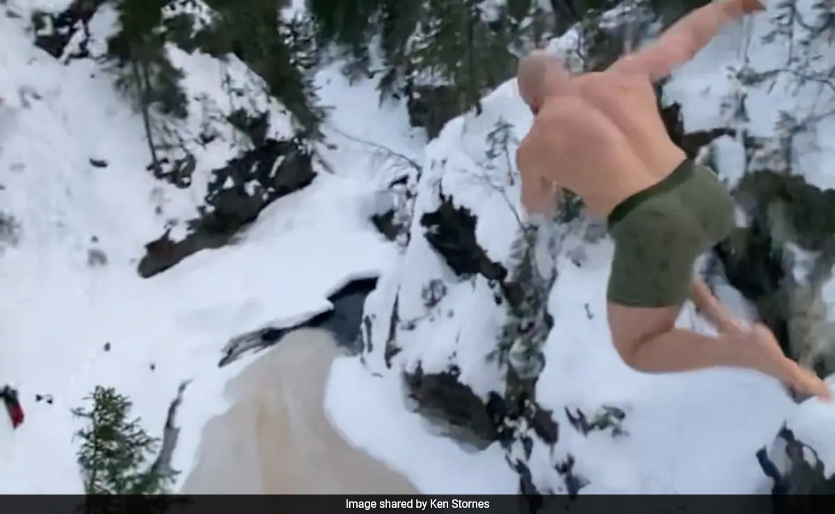 Video Shows Man's Death-Defying Icy Dive, Spectators Stunned