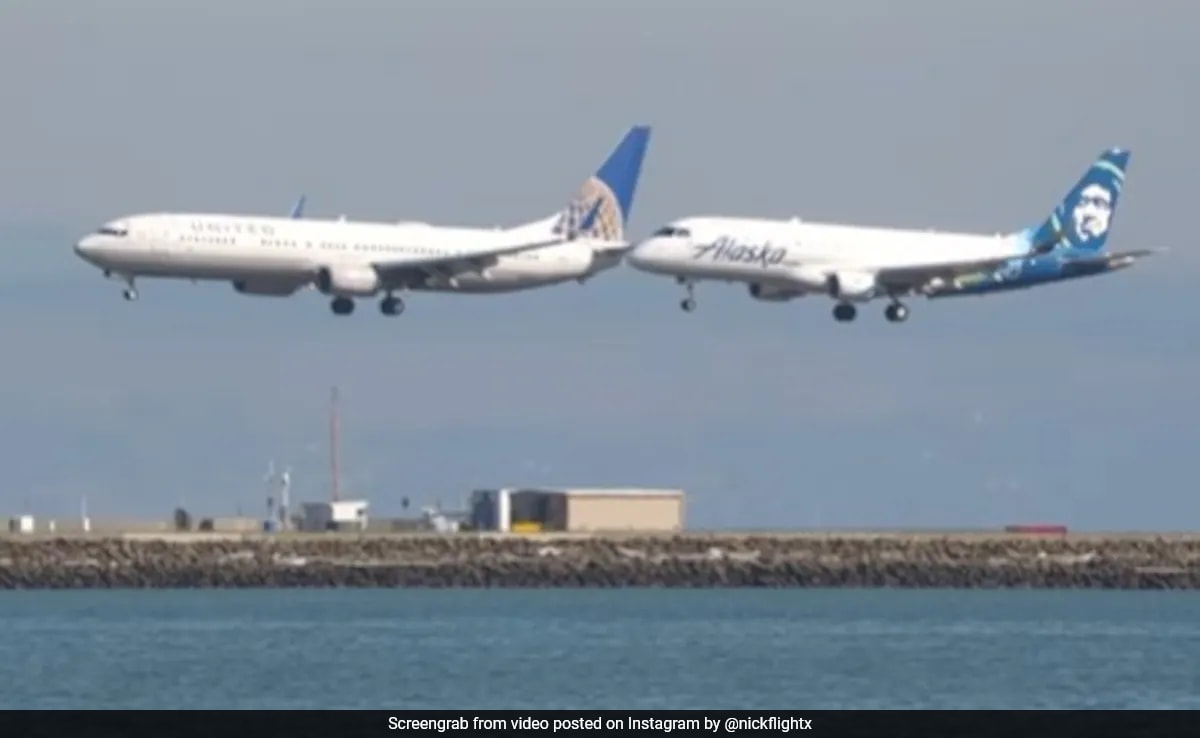 Video Shows Two Passenger Planes Land Side By Side On Parallel Runways ...
