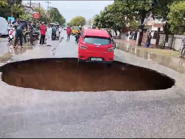 Car Hangs On Edge Of Giant Pothole As Lucknow Road Caves In After Rain