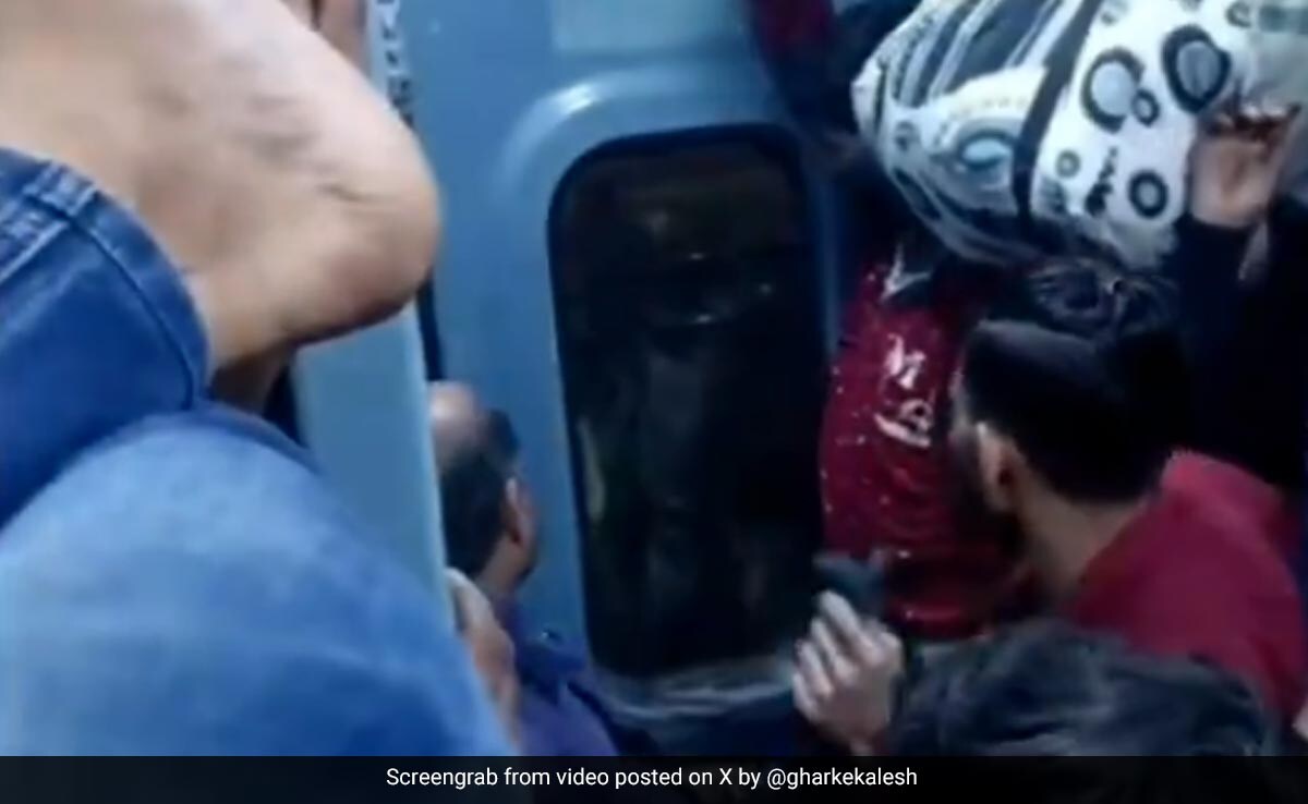 Railway passenger unable to board ac coach breaks train doors glass ...