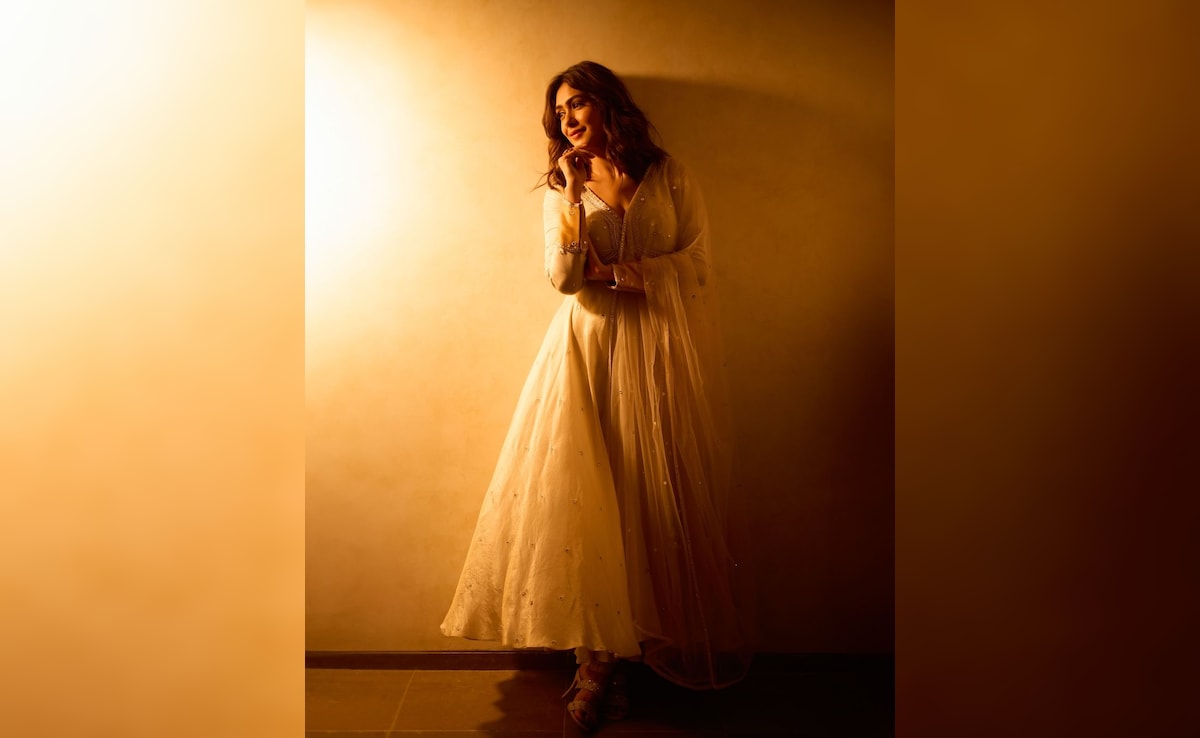 Bollywood Actress Mrunal Thakur Exudes Elegance In A White Anarkali Suit