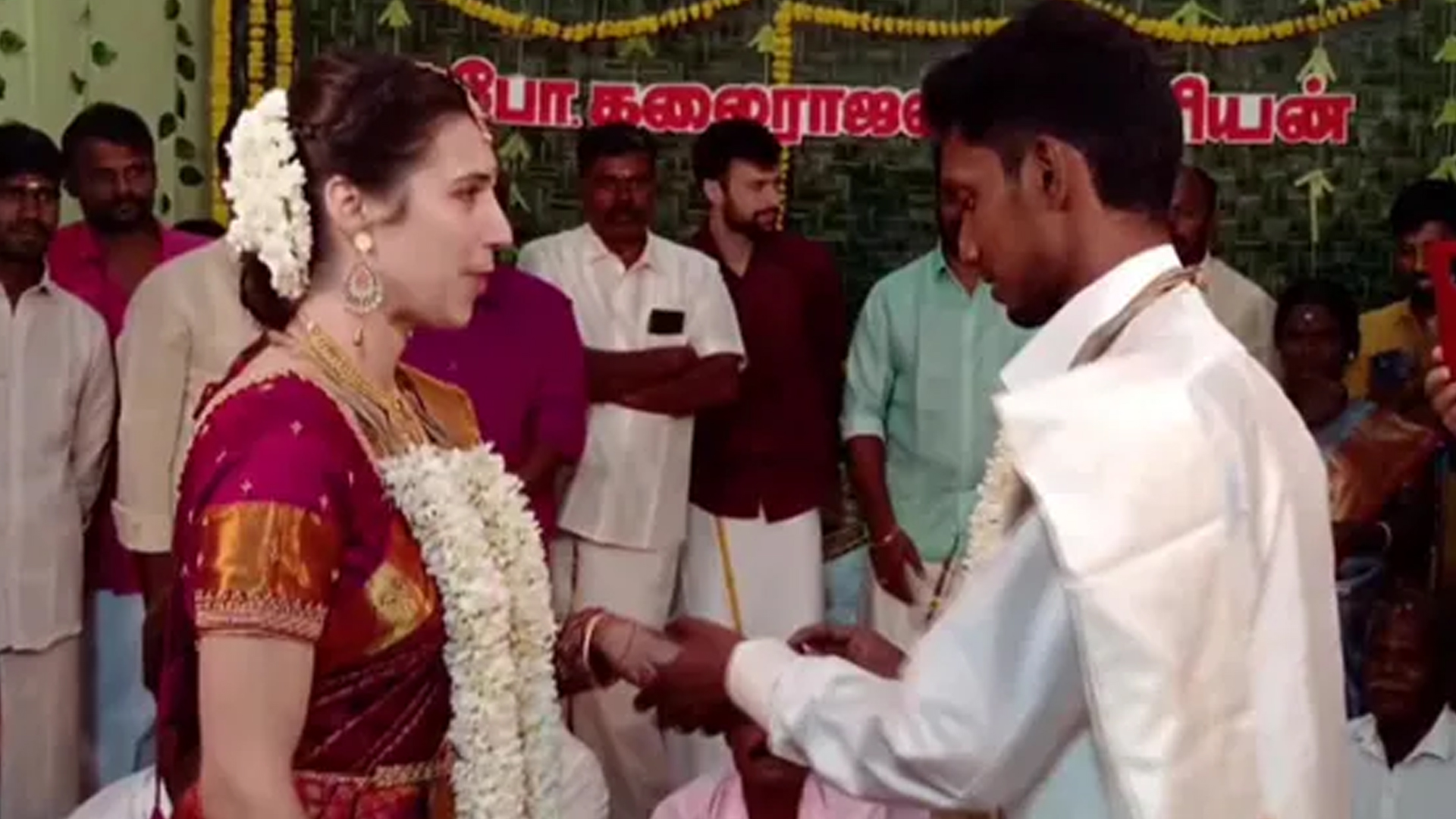 Tamil Man And French Woman Exchange Marriage Vows According To Tamil ...