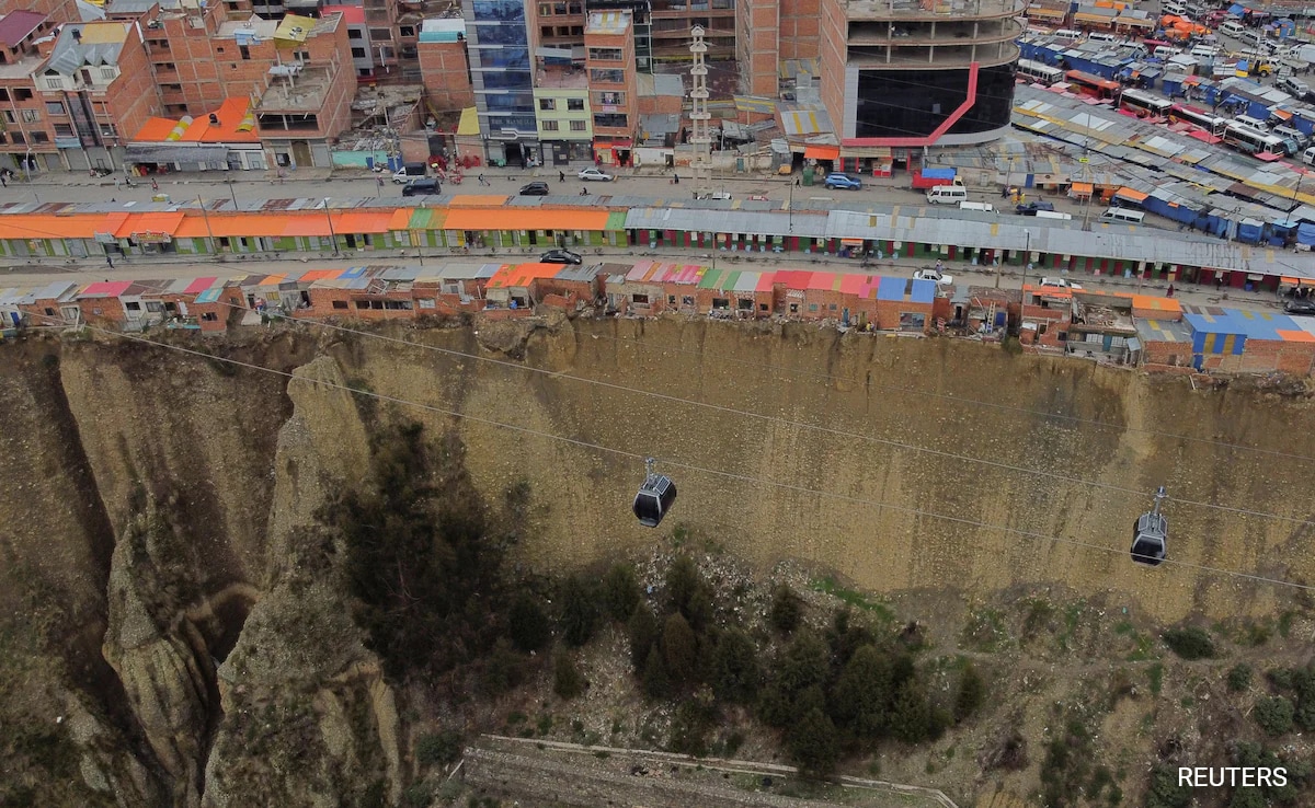 Bolivia's Gravity-Defying 'Suicide Homes' Dangle On A Cliff