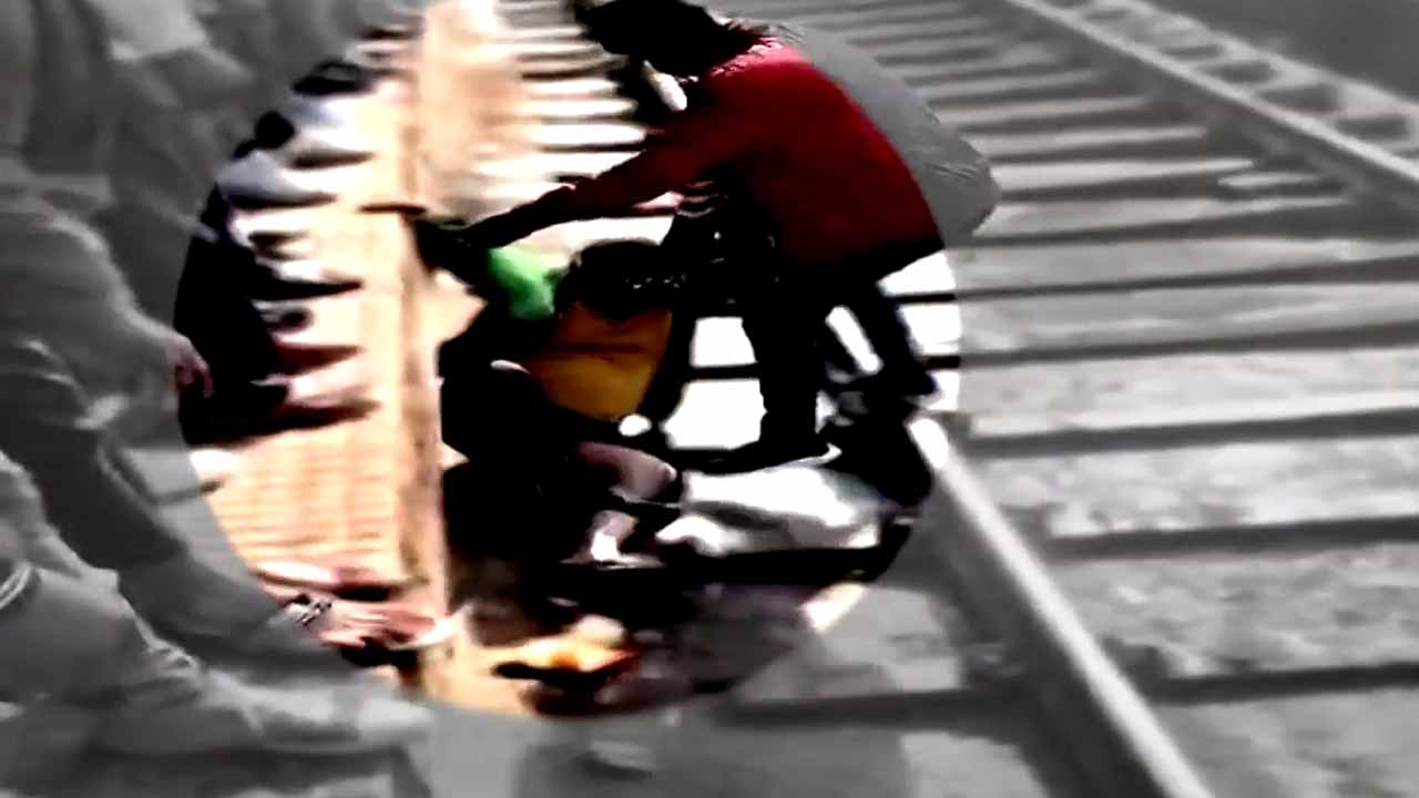 Train Passes Over Man, He Escapes Unhurt