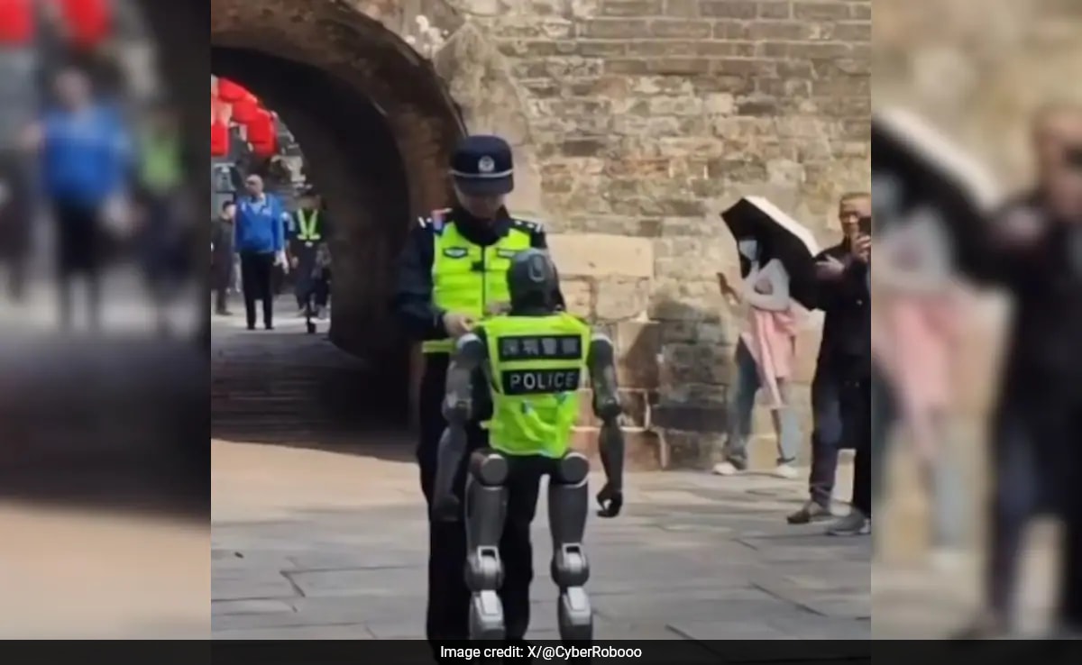 Watch: Humanoid 'Cop' Robots Patrol Chinese Streets, Interact With Public