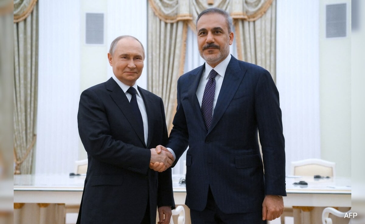 Russian Prime Minister Vladimir Putin And Turkish Foreign Minister ...
