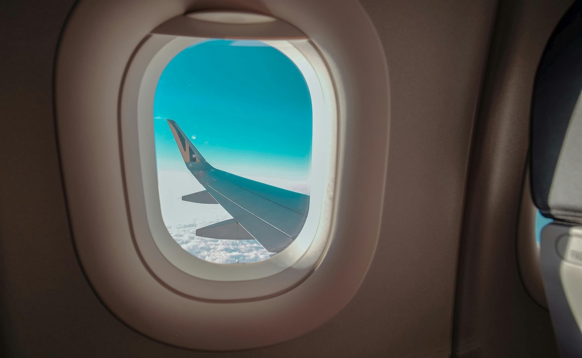 Why Do Airplane Windows Have Tiny Holes? 5 Key Reasons