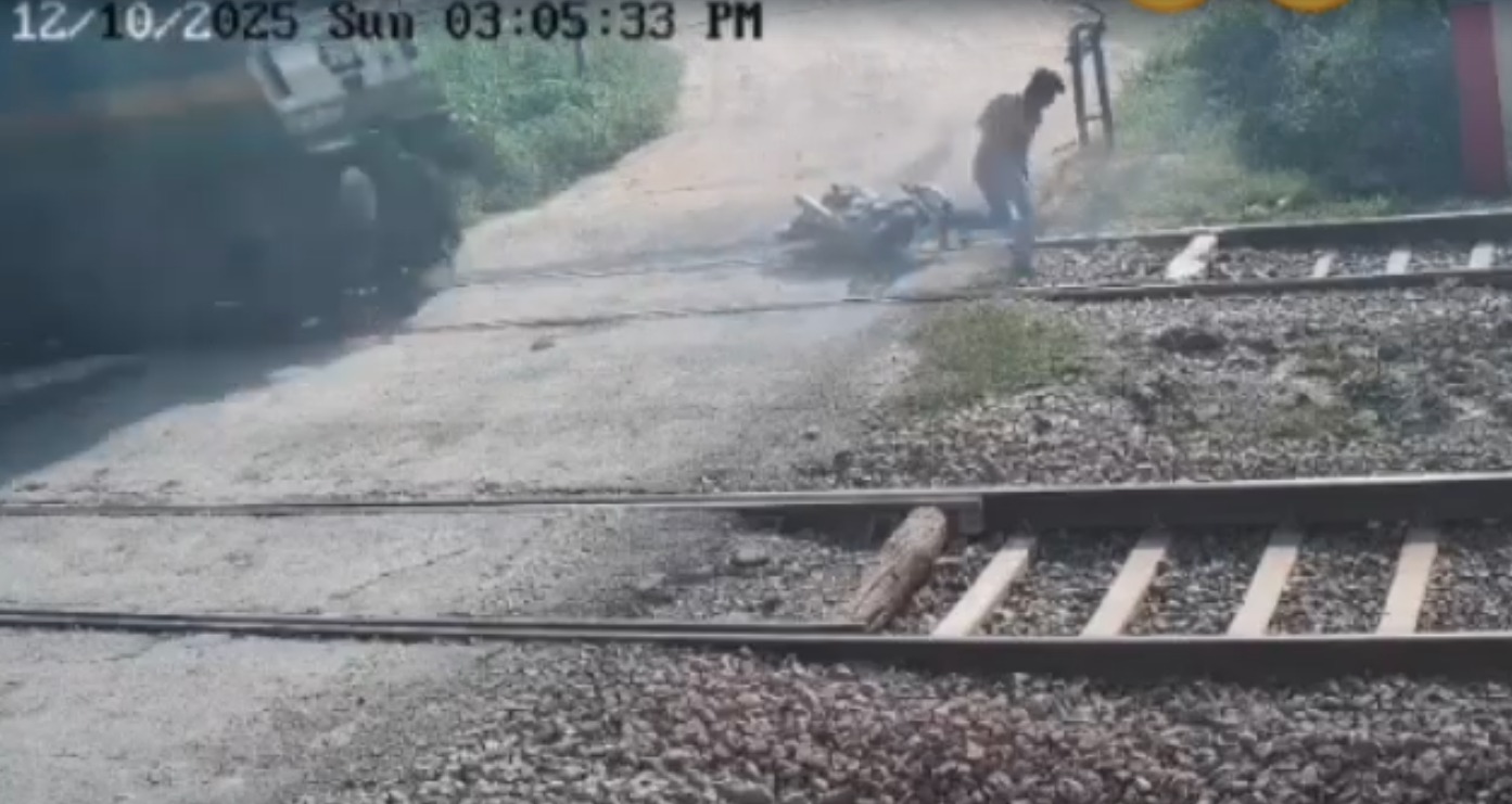 On Camera, UP Man Falls From Bike While Crossing Railway Tracks, Run ...